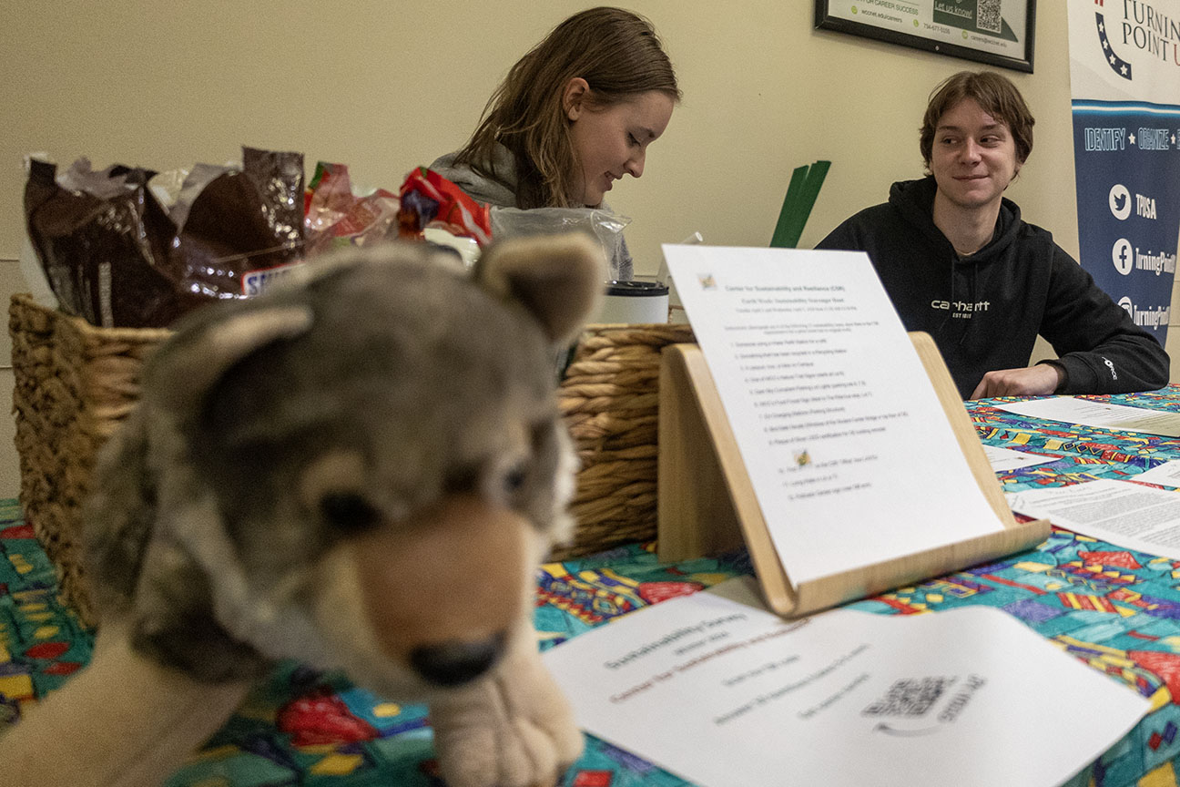 Brie Small and Evan Fleck staff the table at the Sustainability ...